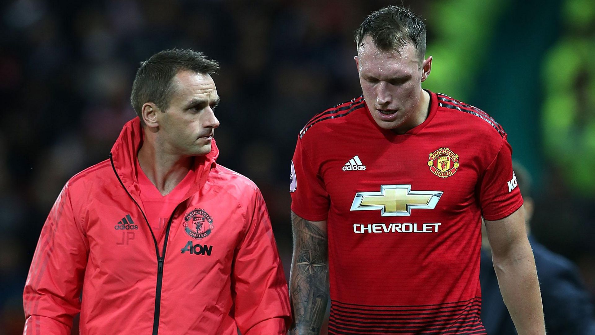 Phil Jones suffers an injury during United v Tottenham at Old Trafford ...