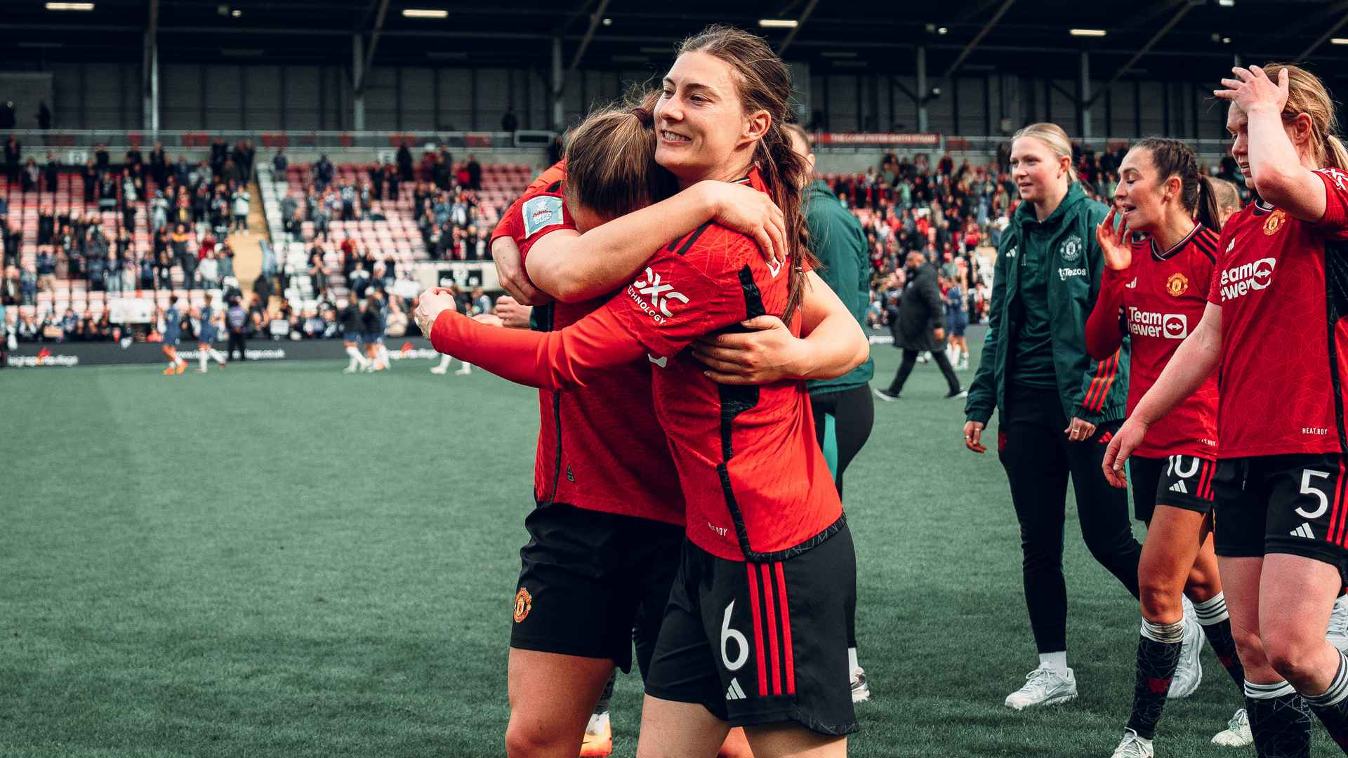 Man Utd Women players celebrate in the dressing room after beating ...