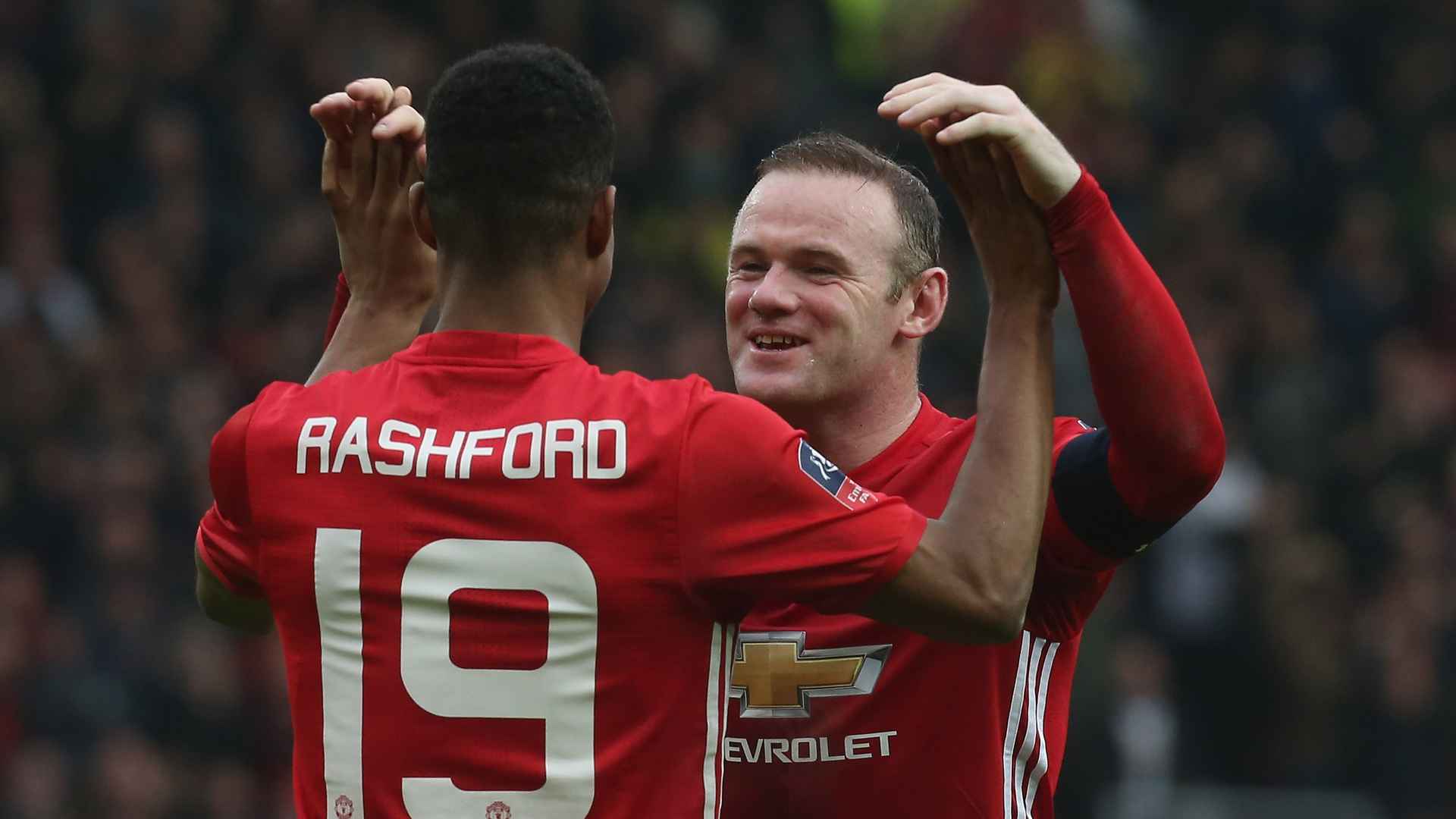 Marcus Rashford and Wayne Rooney embrace after Rashfords record ...